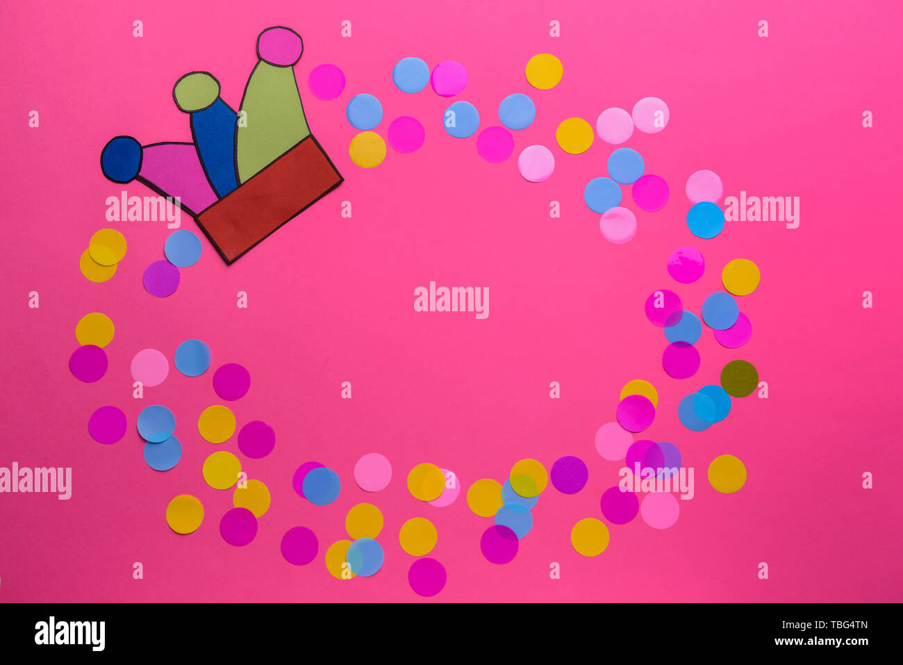 Paper crown with confetti on color background. April Fool's Day ...