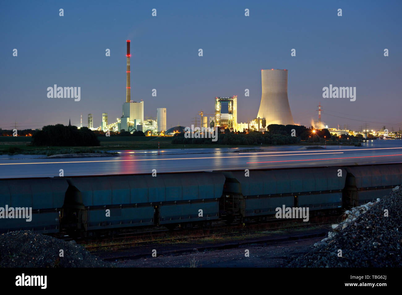 Old and new coal power stations side by side with reflection in the ...