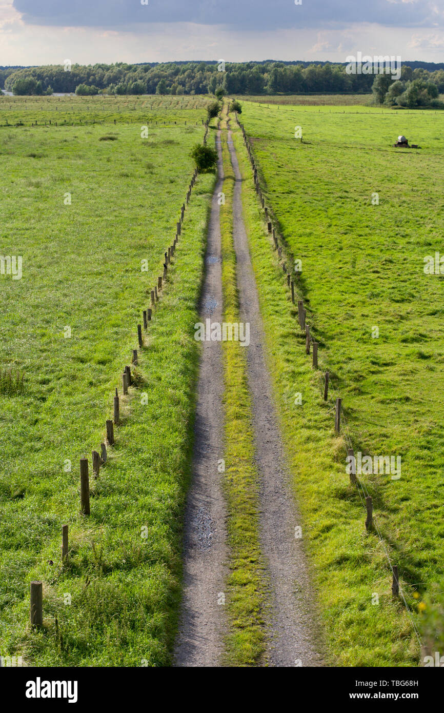 A straight country road with fence and fields seen from above Stock ...