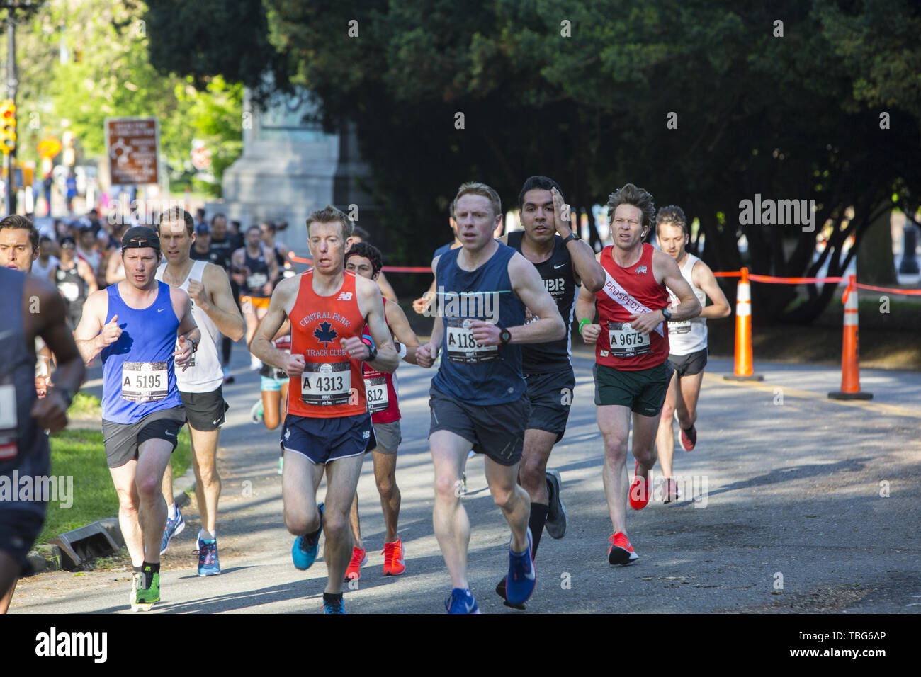 Runners in Prospect Park completing the first leg of the Brooklyn 1/2 ...