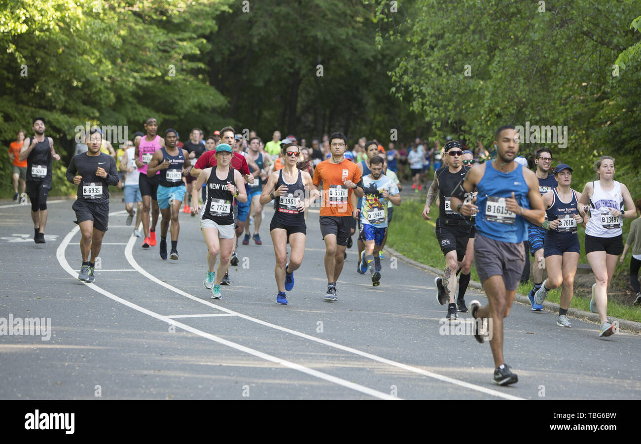 Runners in Prospect Park completing the first leg of the Brooklyn 1/2 ...
