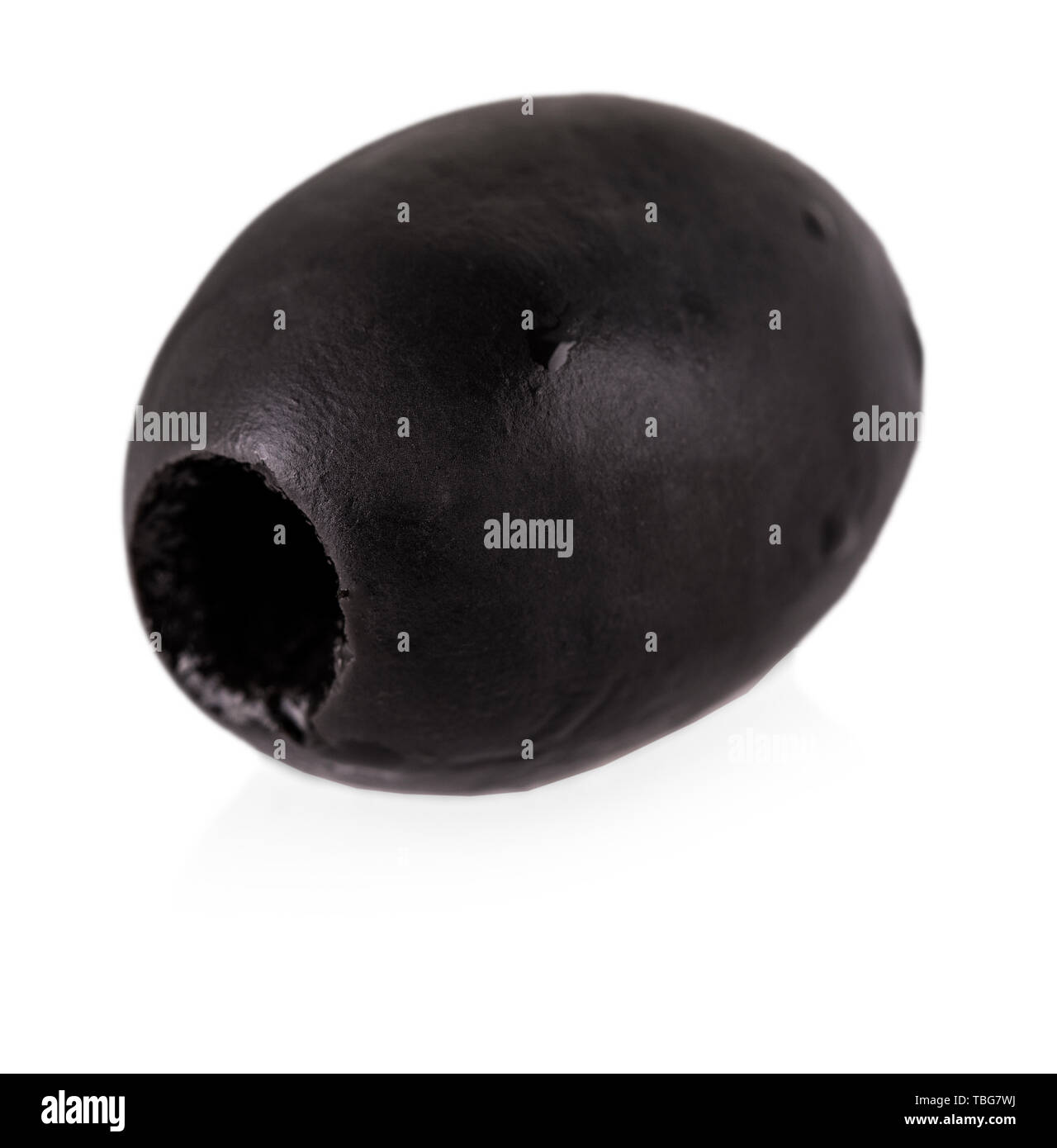 black olive in pool of oil on white background Stock Photo - Alamy