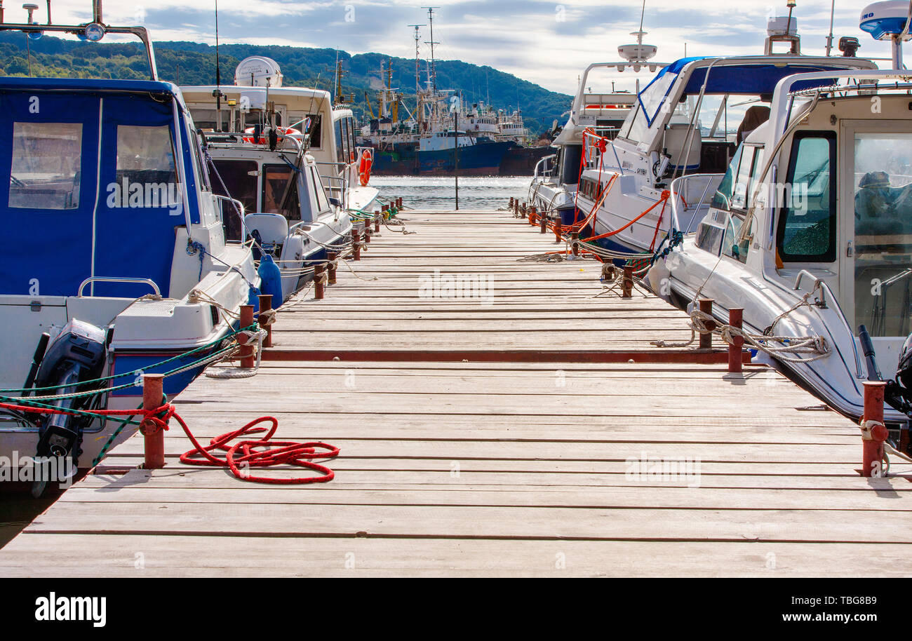 wooden pier for motor boats and sailing yachts Stock Photo - Alamy
