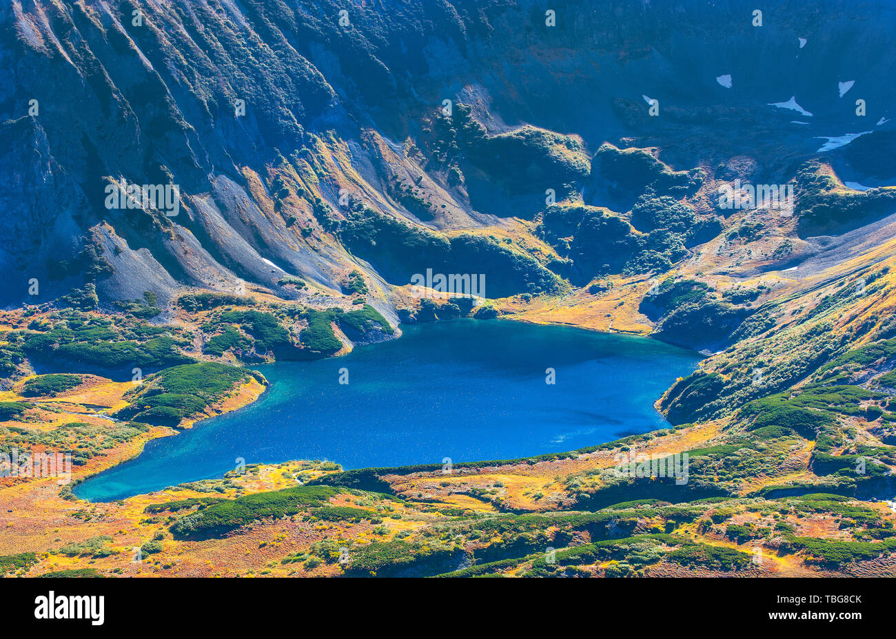 Blue lake in the crater of an extinct volcano in Kamchatka Stock Photo ...