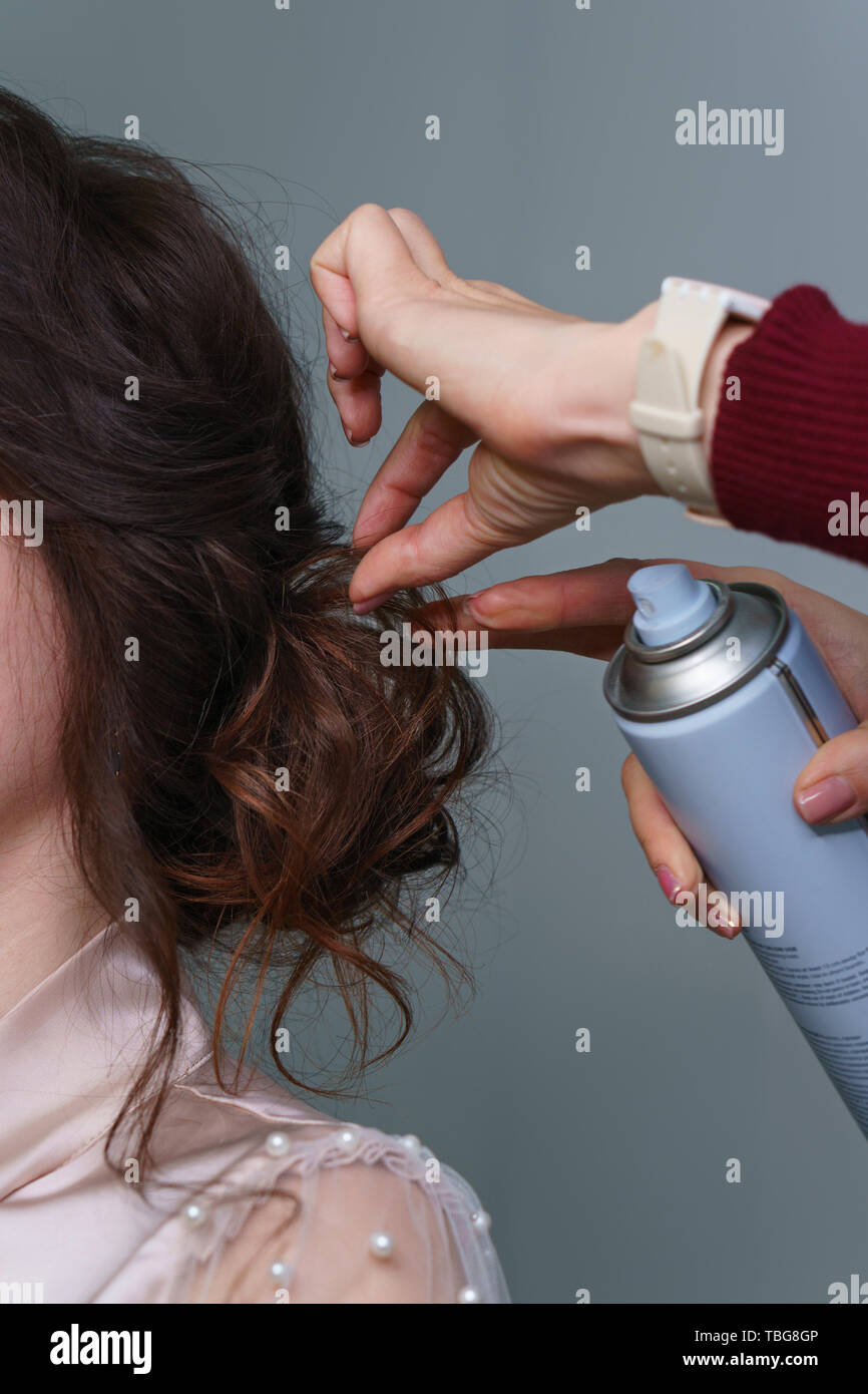 Creating image of bride. Masterpiece. Master stylist makes bride ...