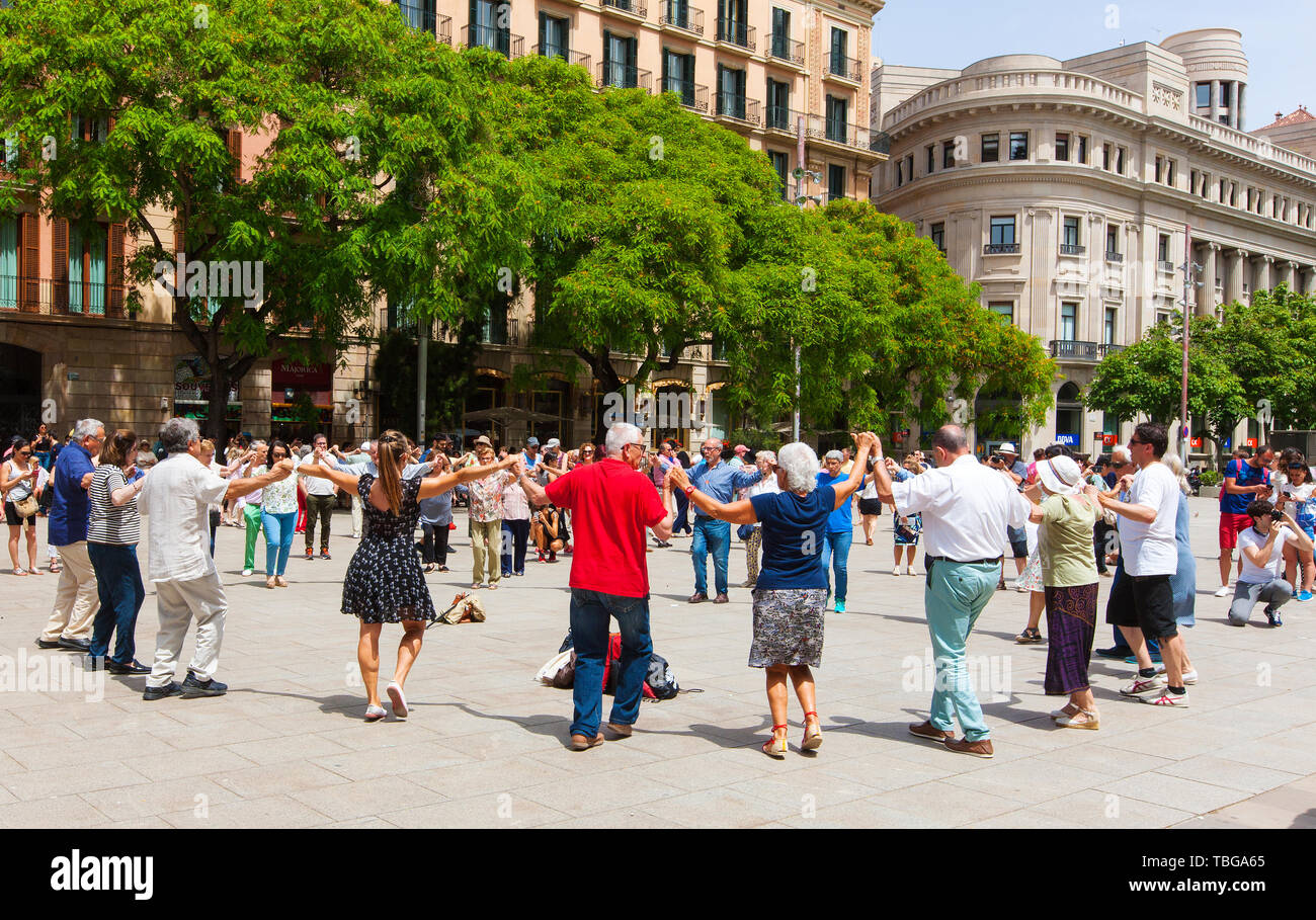 Barcelona, Spain- 10 JUNE 2018: Senior people holding hands and dancing ...