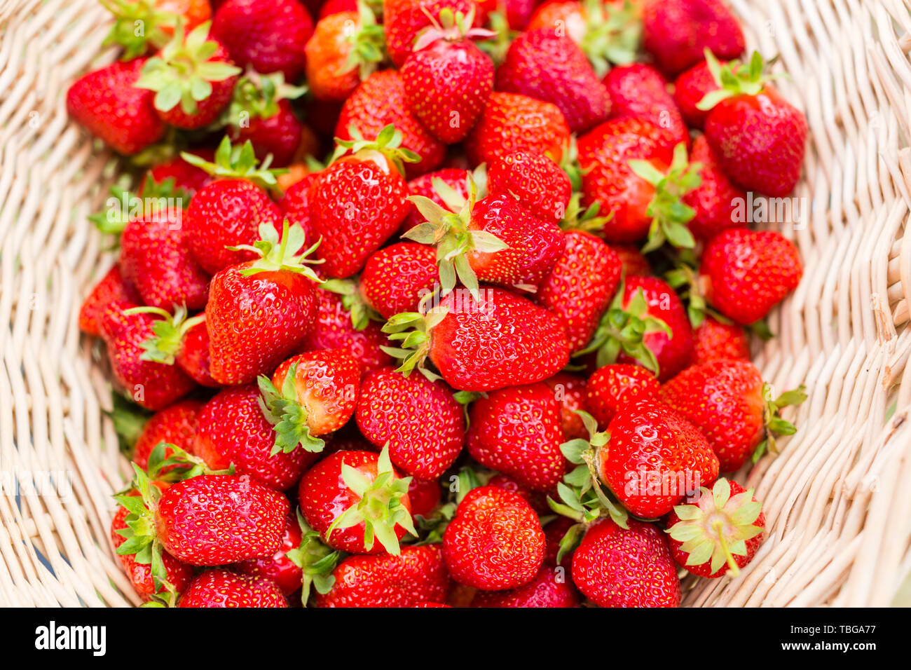 Strawberries in a basket Stock Photo - Alamy