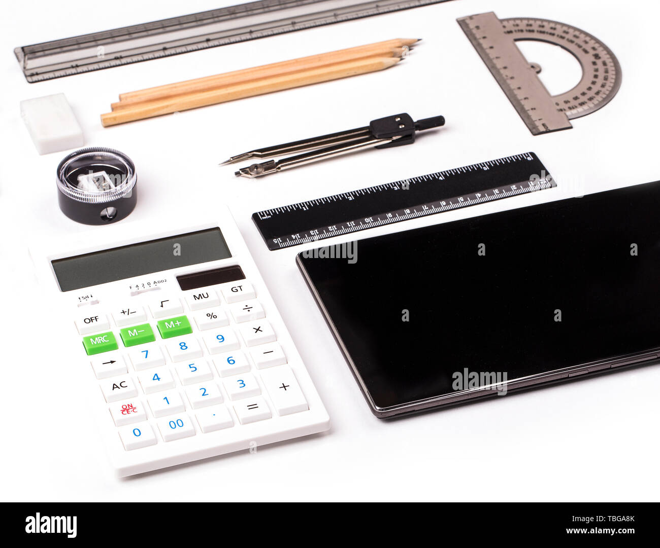 Business concept: tablet, calculator, ruler, pencil and compass on ...