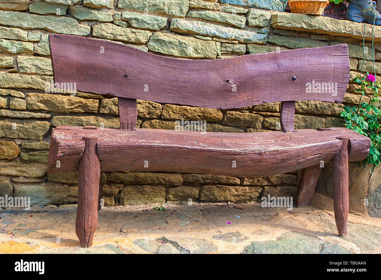 old wooden bench at the wall of the stone house Stock Photo - Alamy