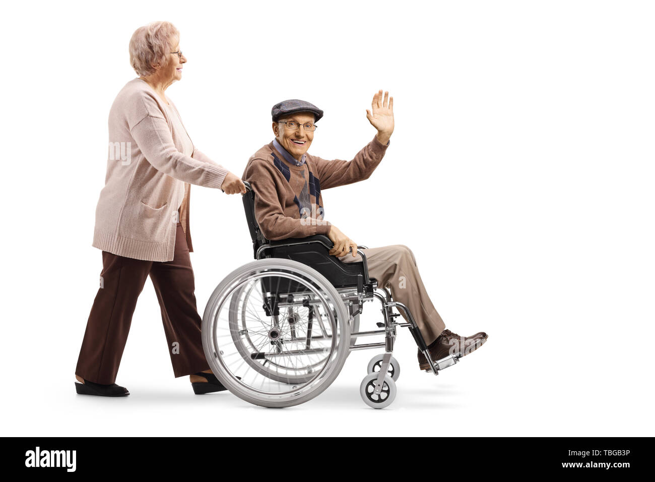 Full length shot of an elderly woman pushing an elderly man waving and ...