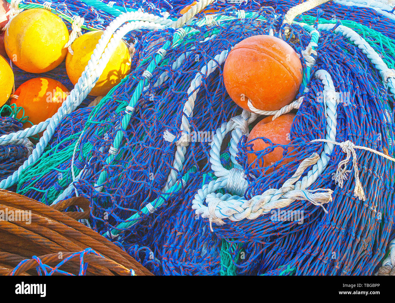 The colored fishing net with floats Stock Photo - Alamy
