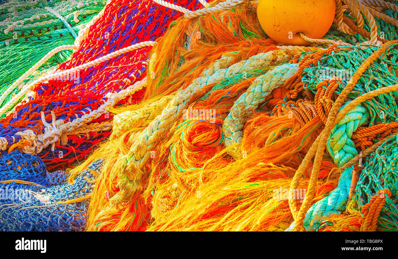 The colored fishing net with floats Stock Photo - Alamy