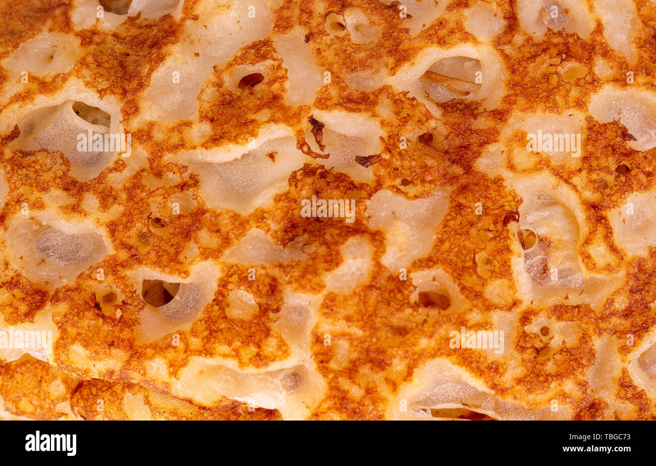 Texture of a cooked thin pancake closeup Stock Photo - Alamy