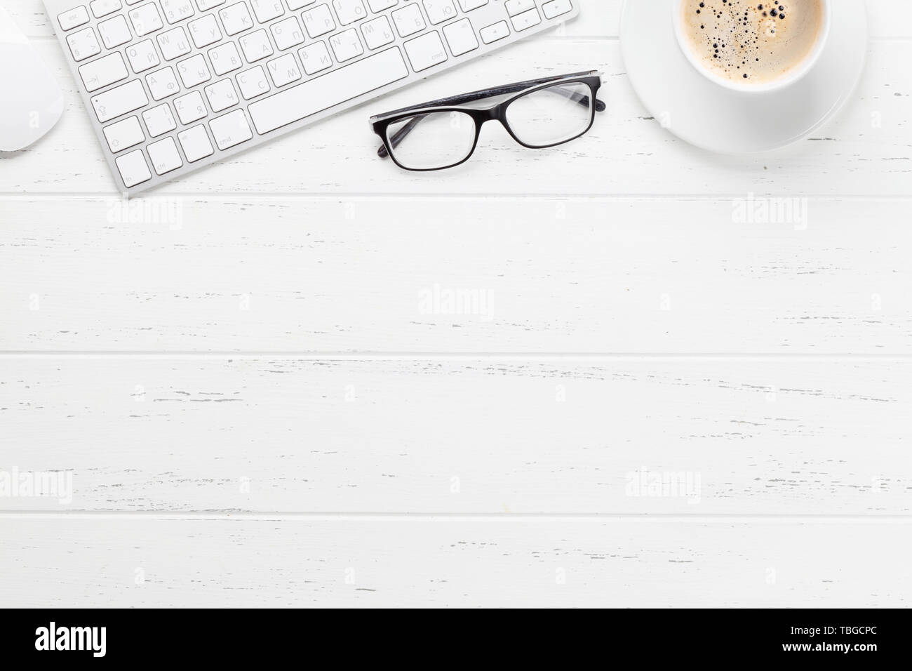 Office workplace table with coffee cup, supplies and computer. Flat lay ...