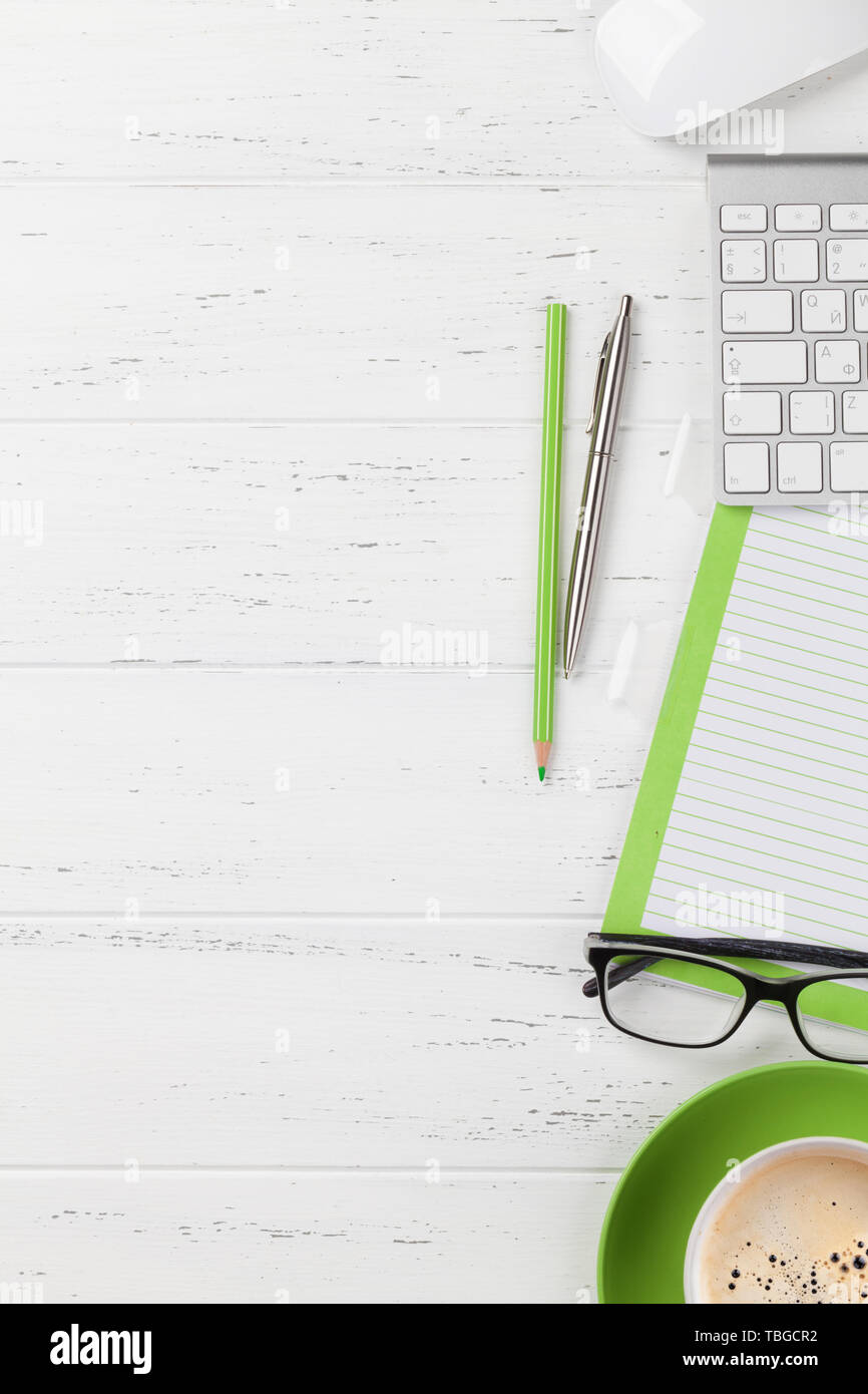 Office workplace table with coffee cup, supplies and computer. Flat lay ...