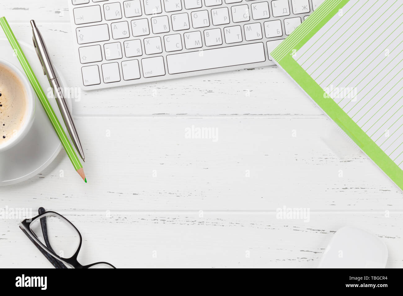 Office workplace table with coffee cup, supplies and computer. Flat lay ...
