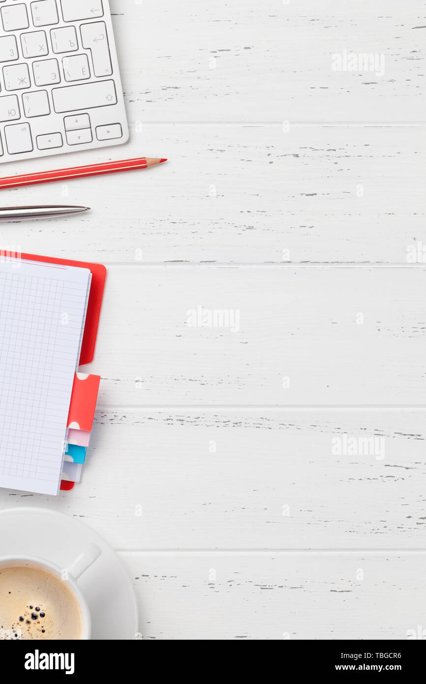Office workplace table with coffee cup, supplies and computer. Flat lay ...