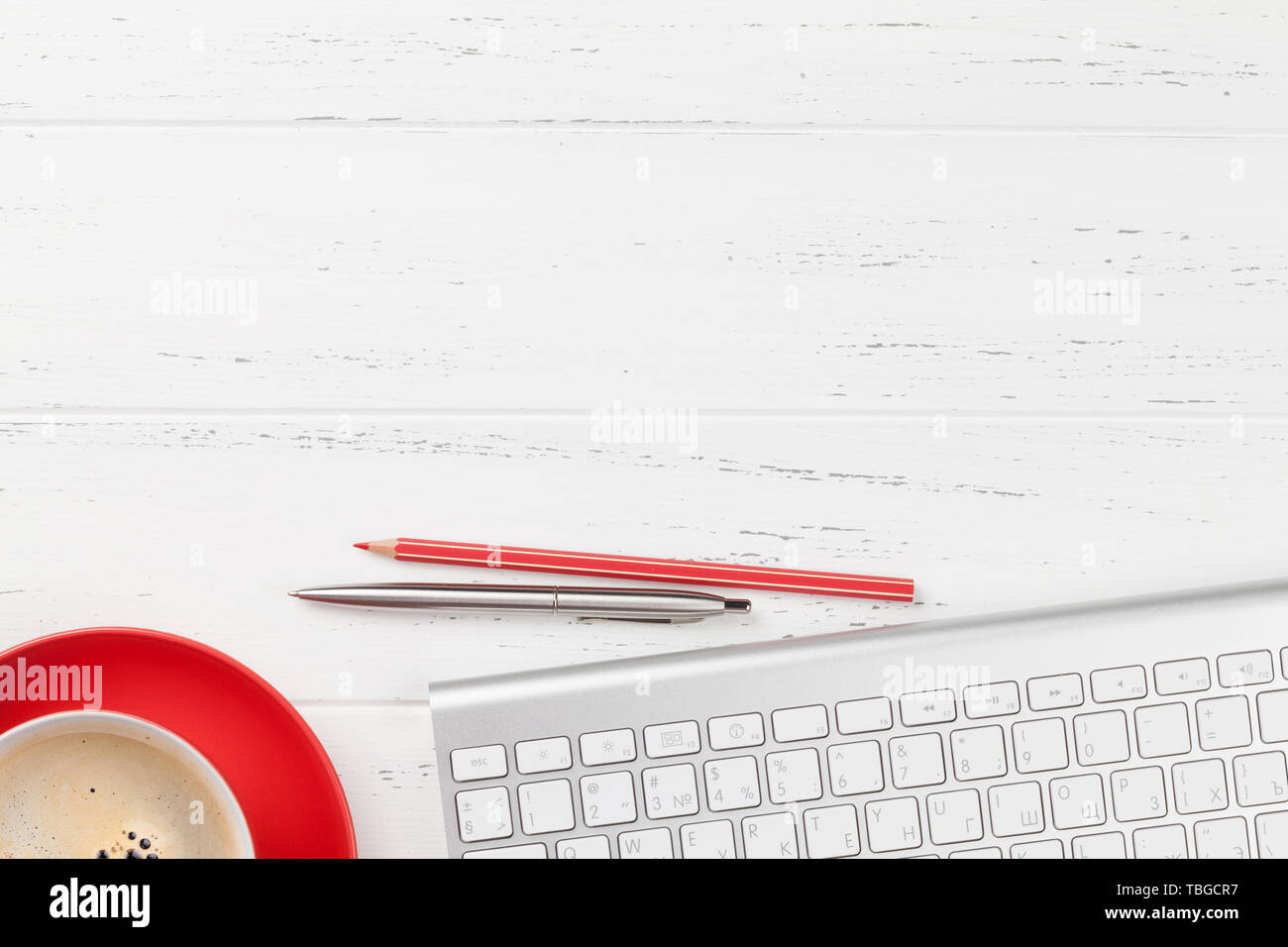 Office workplace table with coffee cup, supplies and computer. Flat lay ...