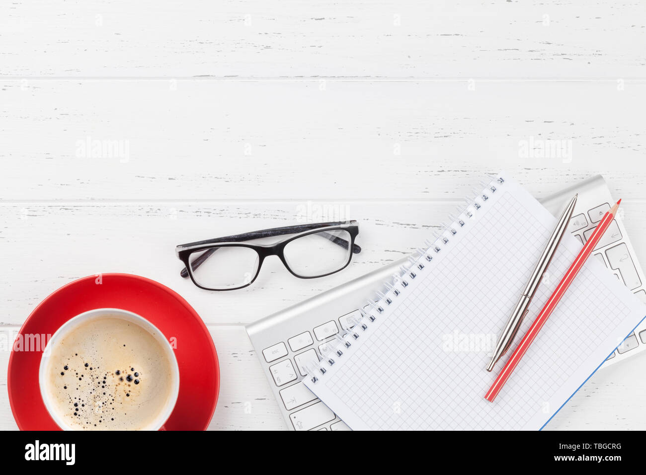 Office workplace table with coffee cup, supplies and computer. Flat lay ...