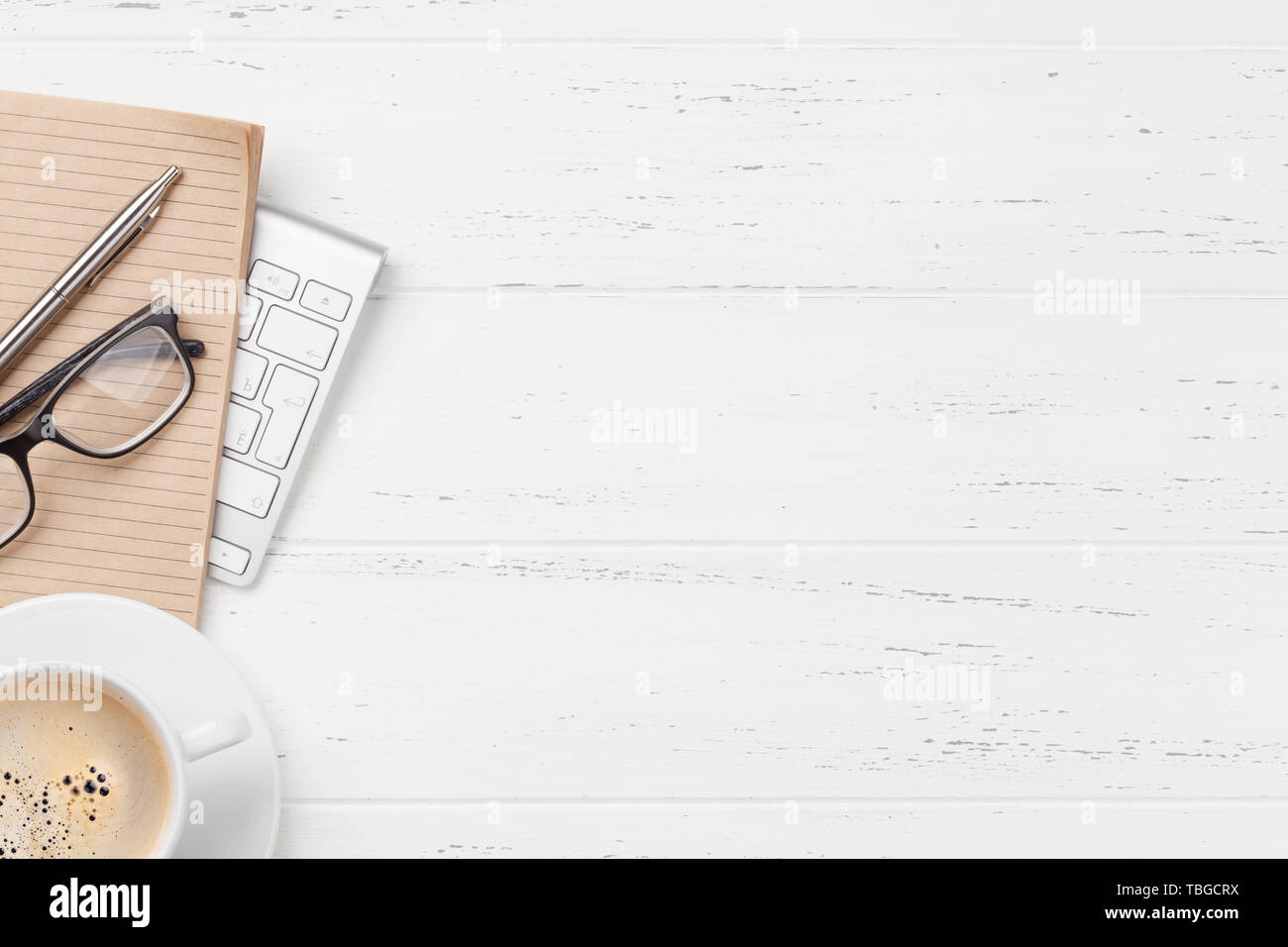 Office workplace table with coffee cup, supplies and computer. Flat lay ...