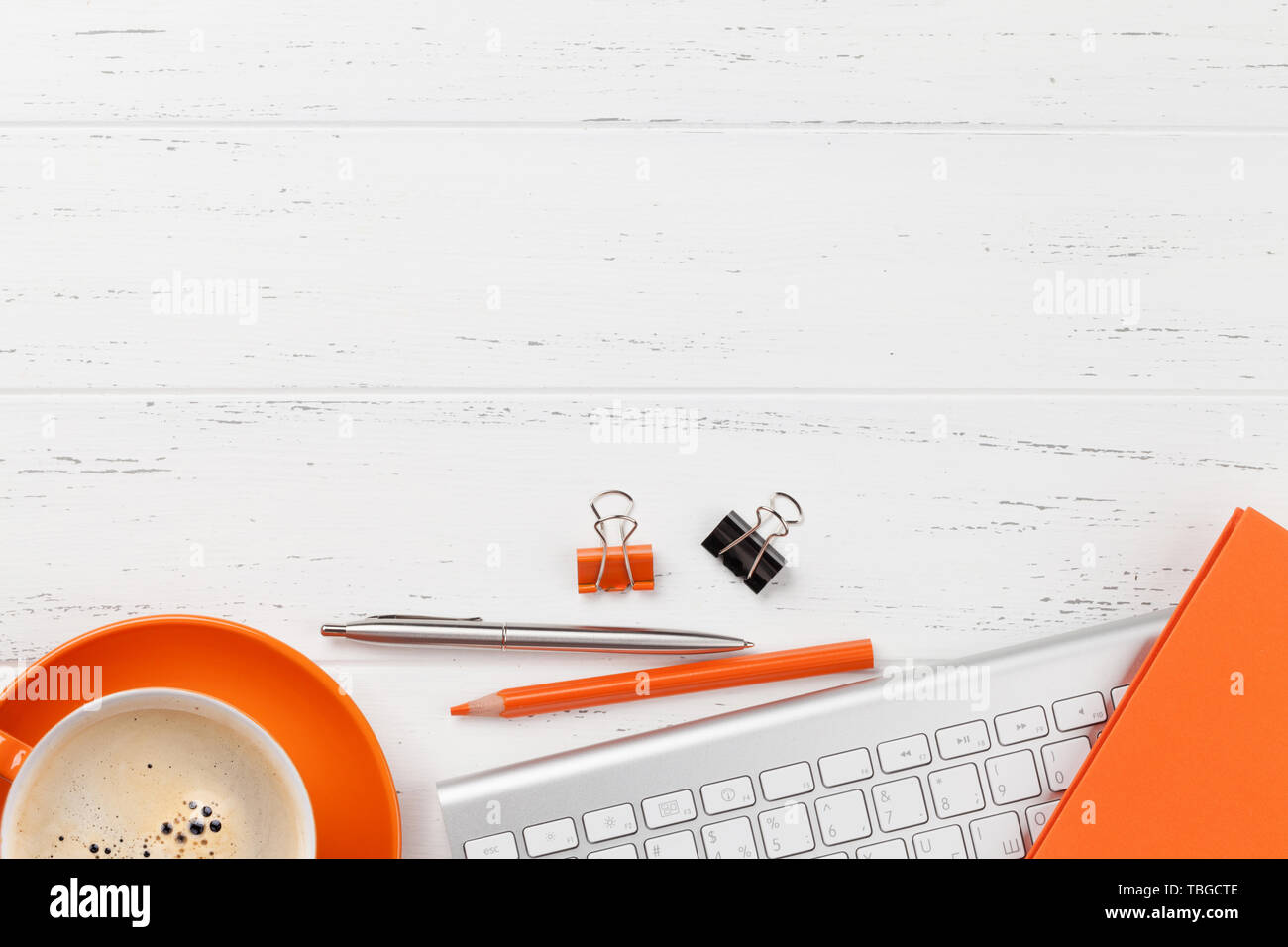 Office workplace table with coffee cup, supplies and computer. Flat lay ...