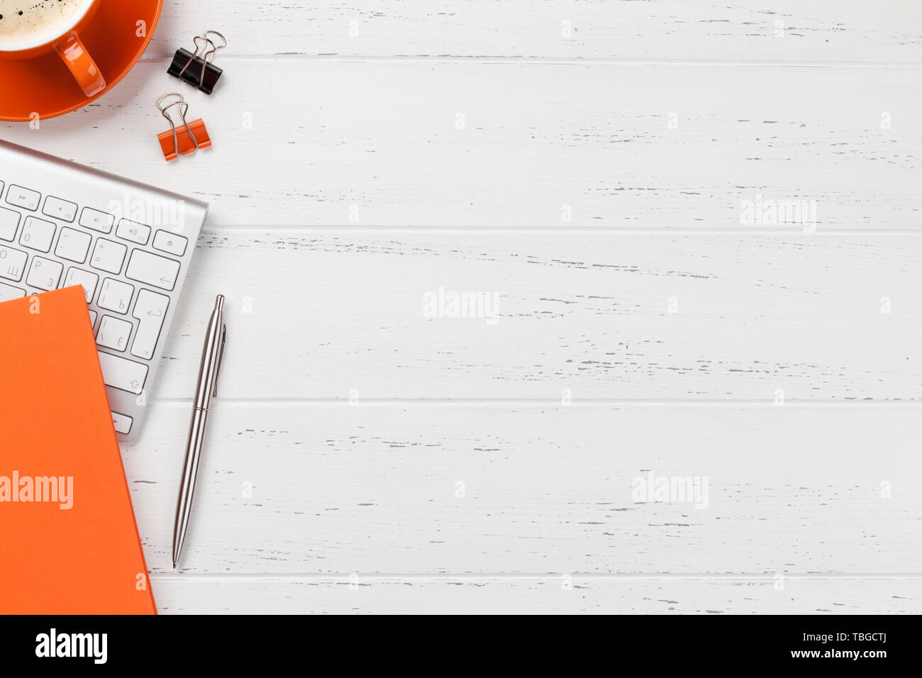 Office workplace table with coffee cup, supplies and computer. Flat lay ...