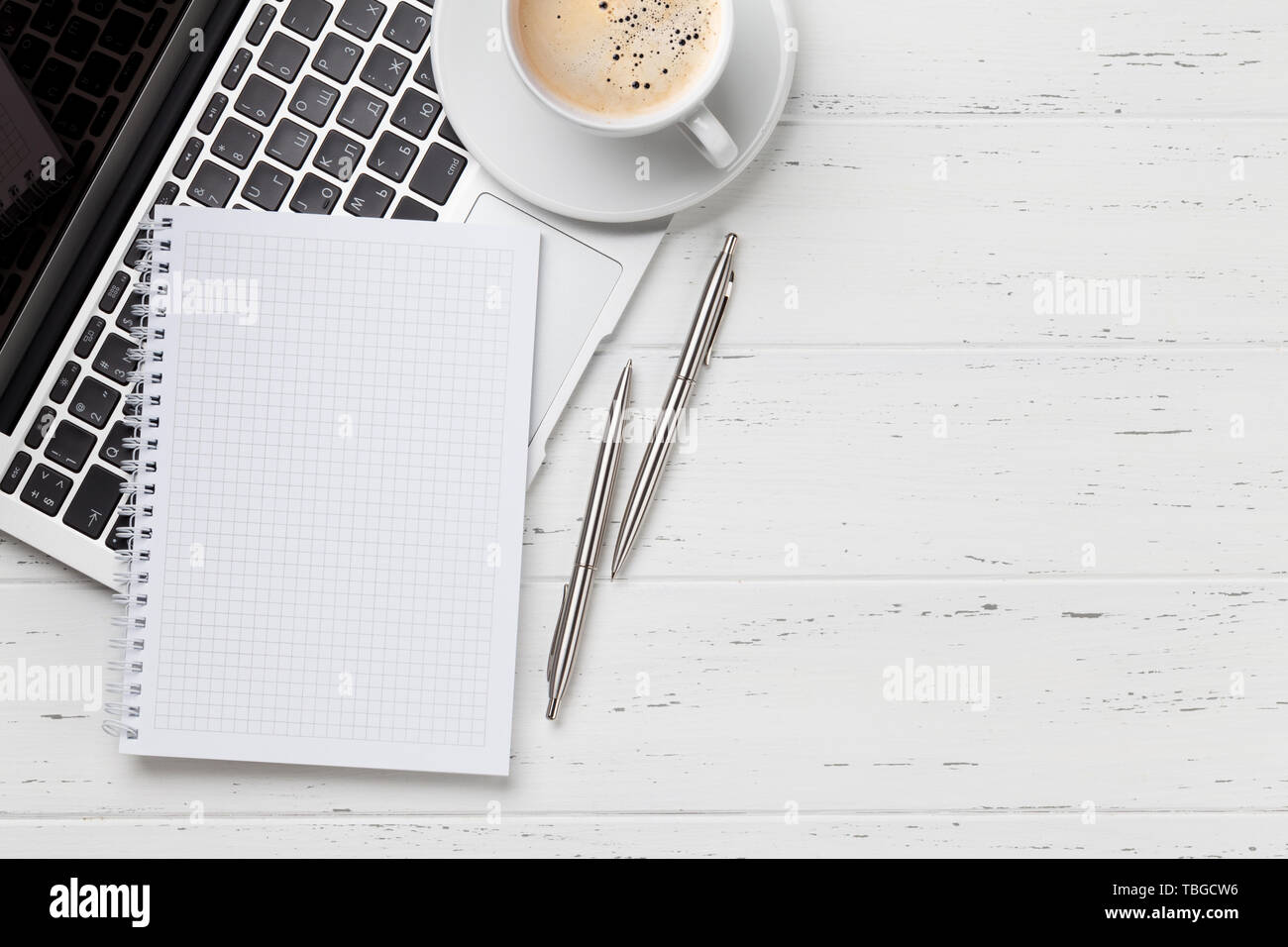 Office workplace table with coffee cup, supplies and computer. Flat lay ...