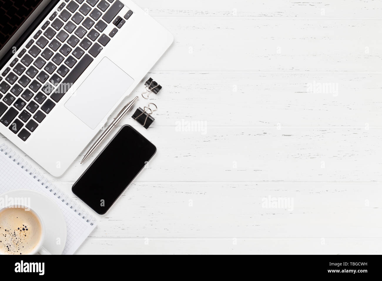 Office workplace table with coffee cup, supplies and computer. Flat lay ...