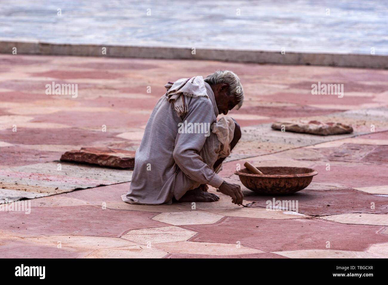 Local worker repairing the tiles in Jama Masjid, Jama Mosque, Fatehpur ...