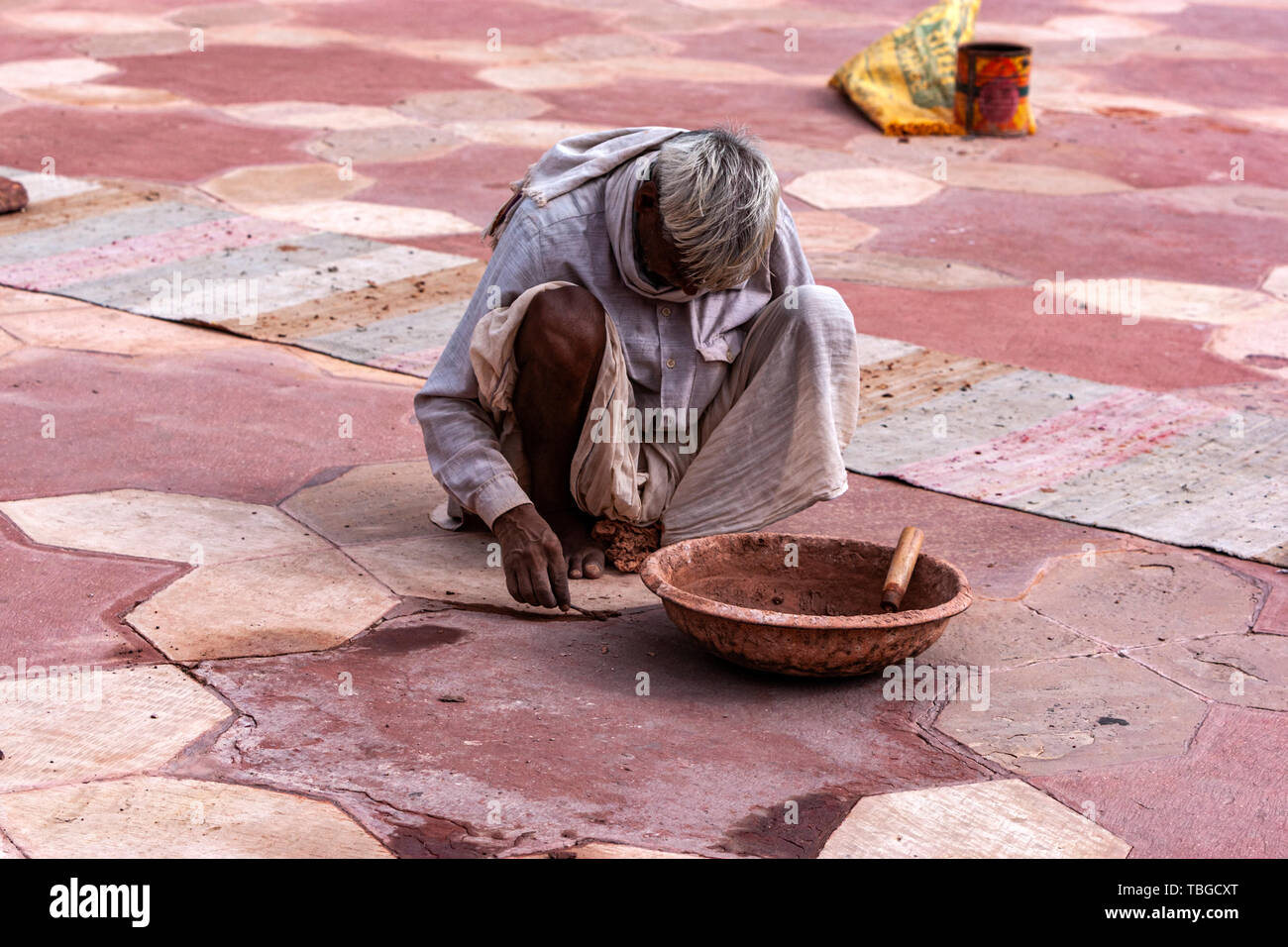Local worker repairing the tiles in Jama Masjid, Jama Mosque, Fatehpur ...