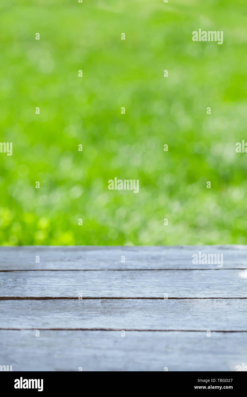 Empty wooden table over blurred sunny bokeh natural background with ...