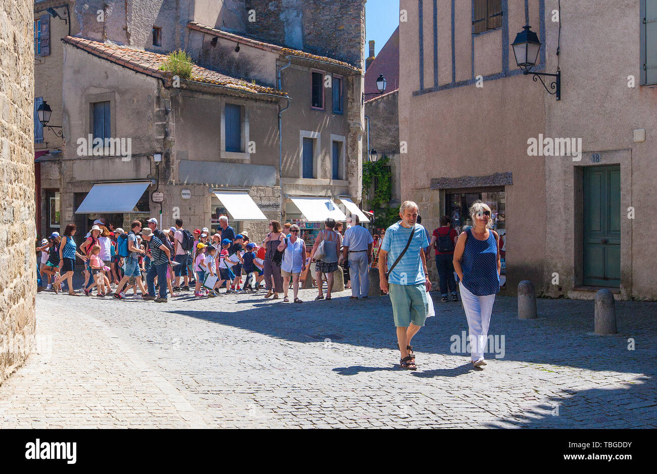 CARCASSONNE, FRANCE - JUNE 2018; A street in Carcassone Old Town with ...