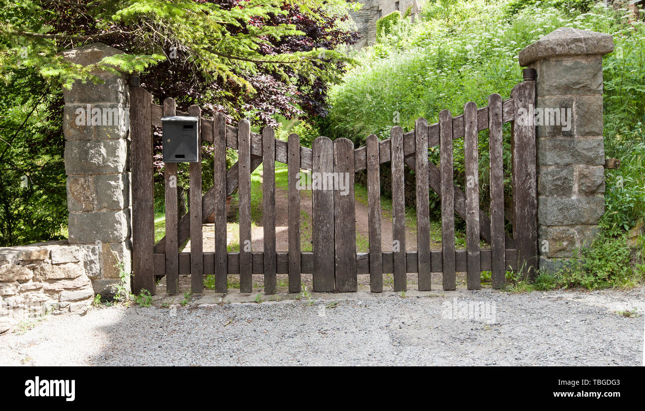 Wooden gate in a stone wall on a farm Stock Photo - Alamy
