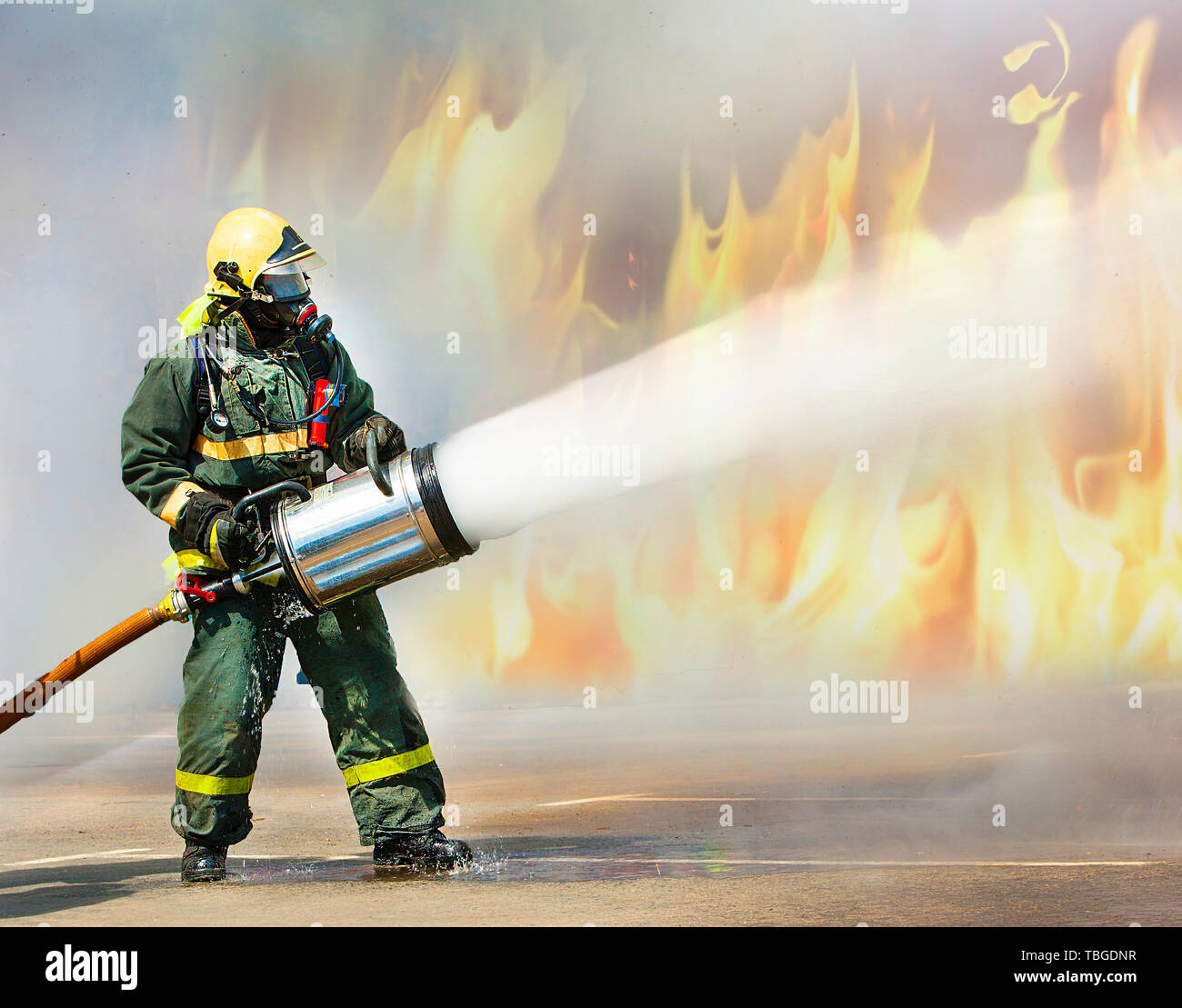 Fire extinguish the fire with foam in the smoke Stock Photo - Alamy