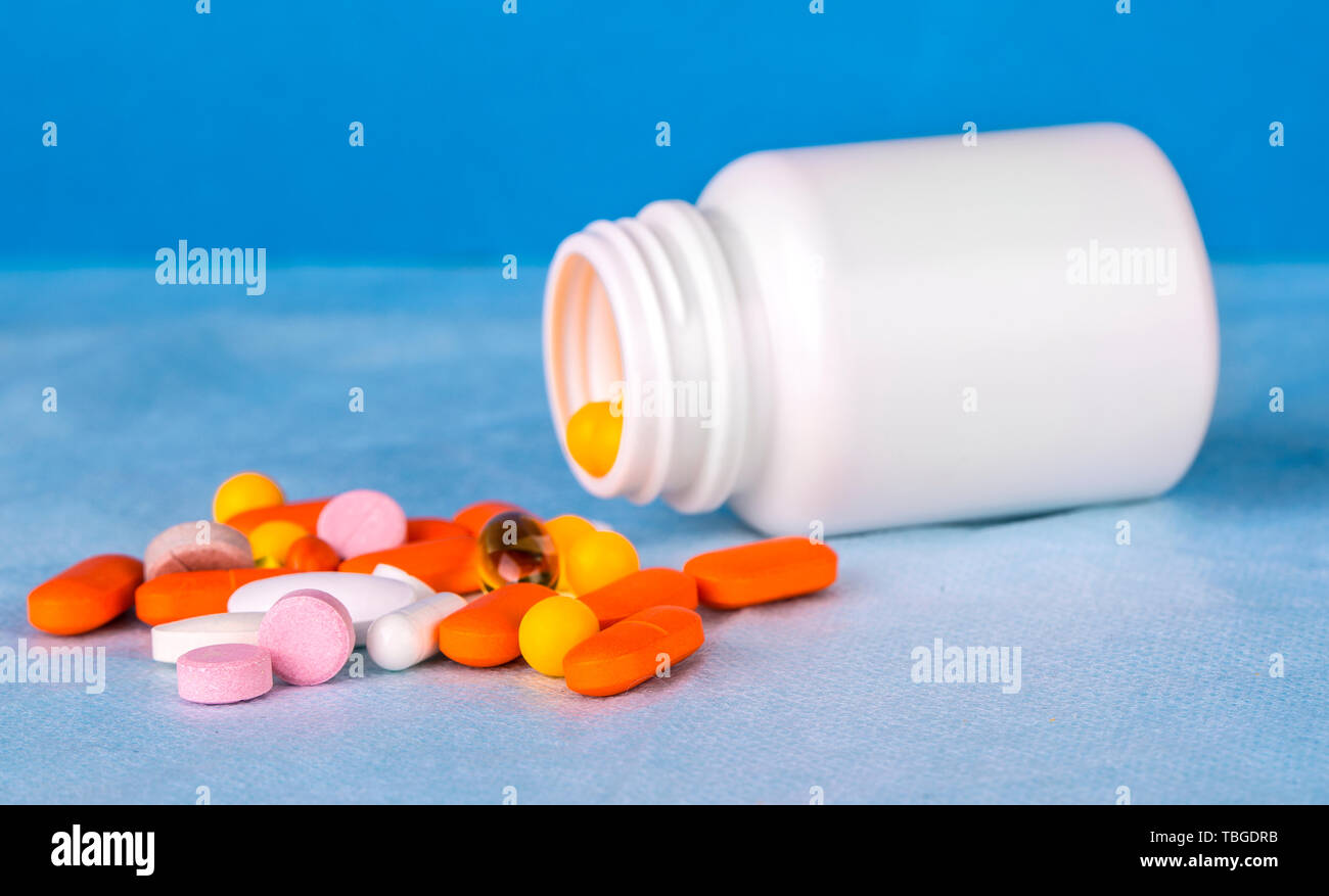 Pills poured from jar hi-res stock photography and images - Alamy