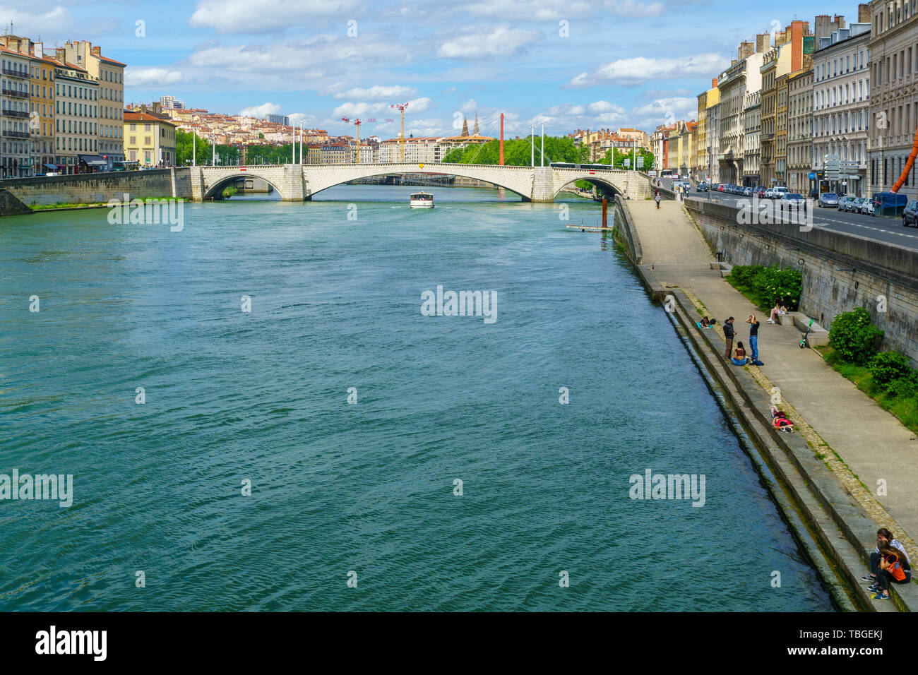 Lyon, France - May 10, 2019: View of the Saone river, with locals and ...