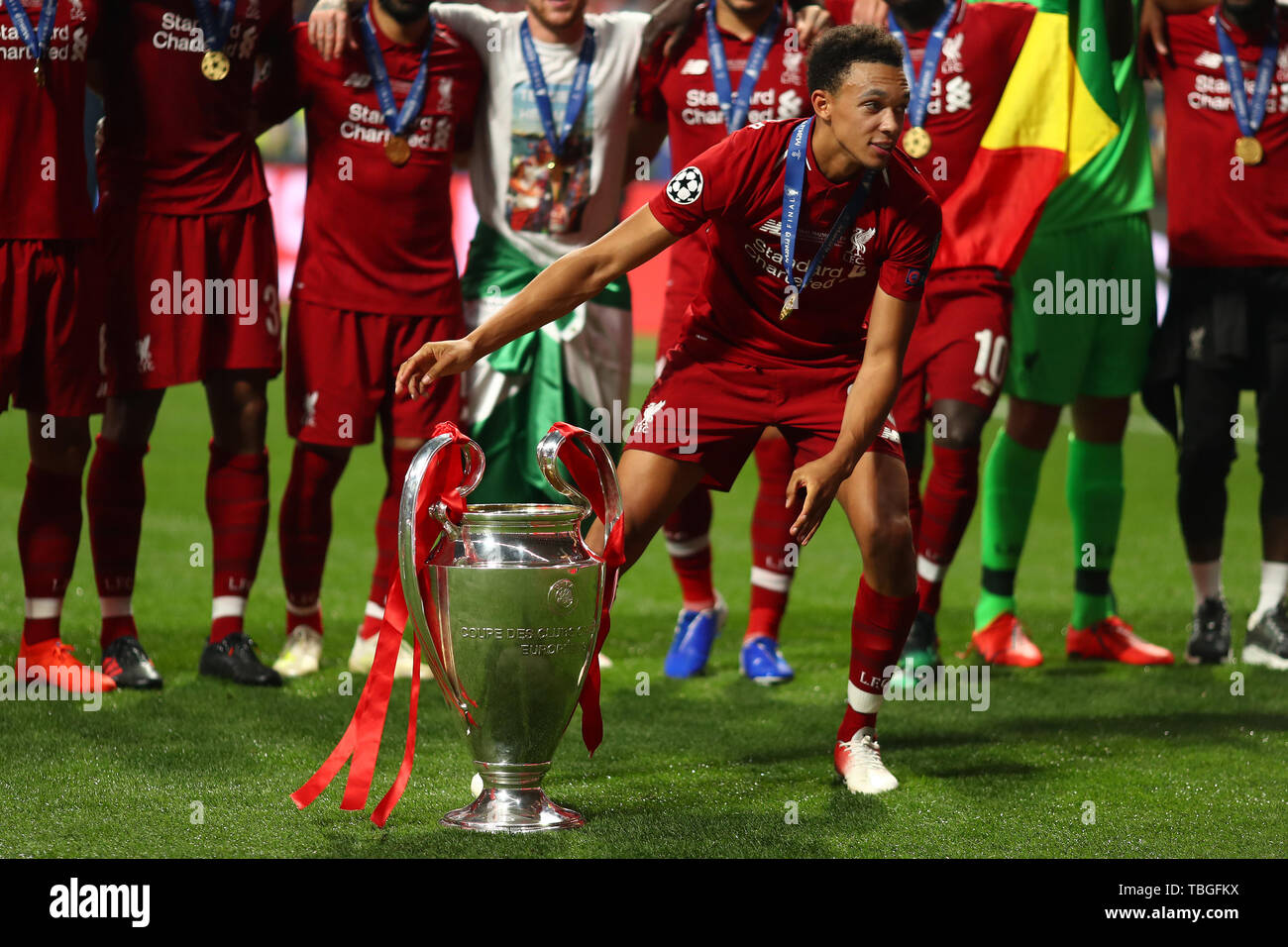 Trent Alexander-Arnold of Liverpool dances around the trophy after ...