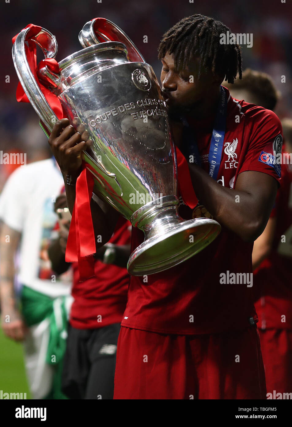 Divock Origi of Liverpool celebrates with the trophy after winning the ...