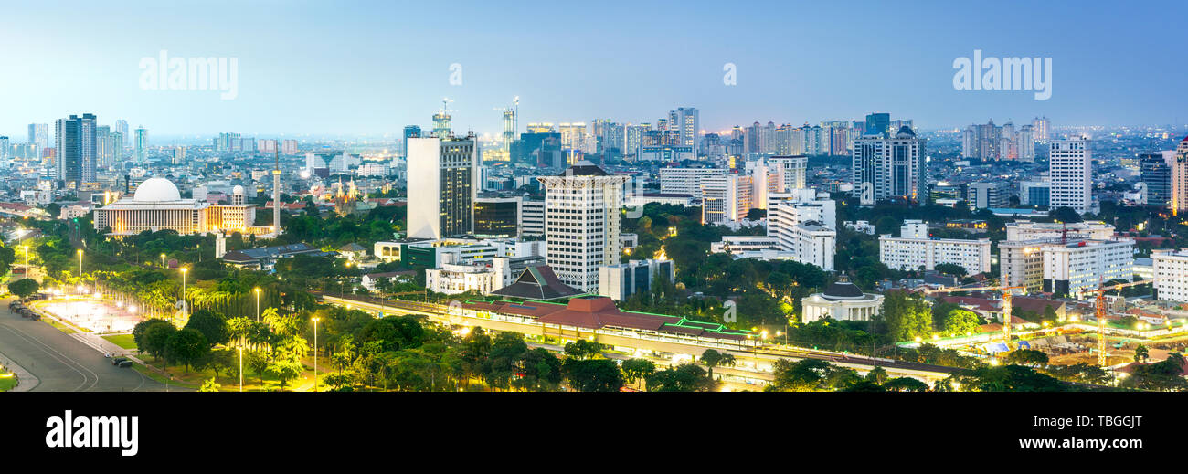 Panoramic Jakarta skyline with iconic symbol likes the Istiqlal mosque ...