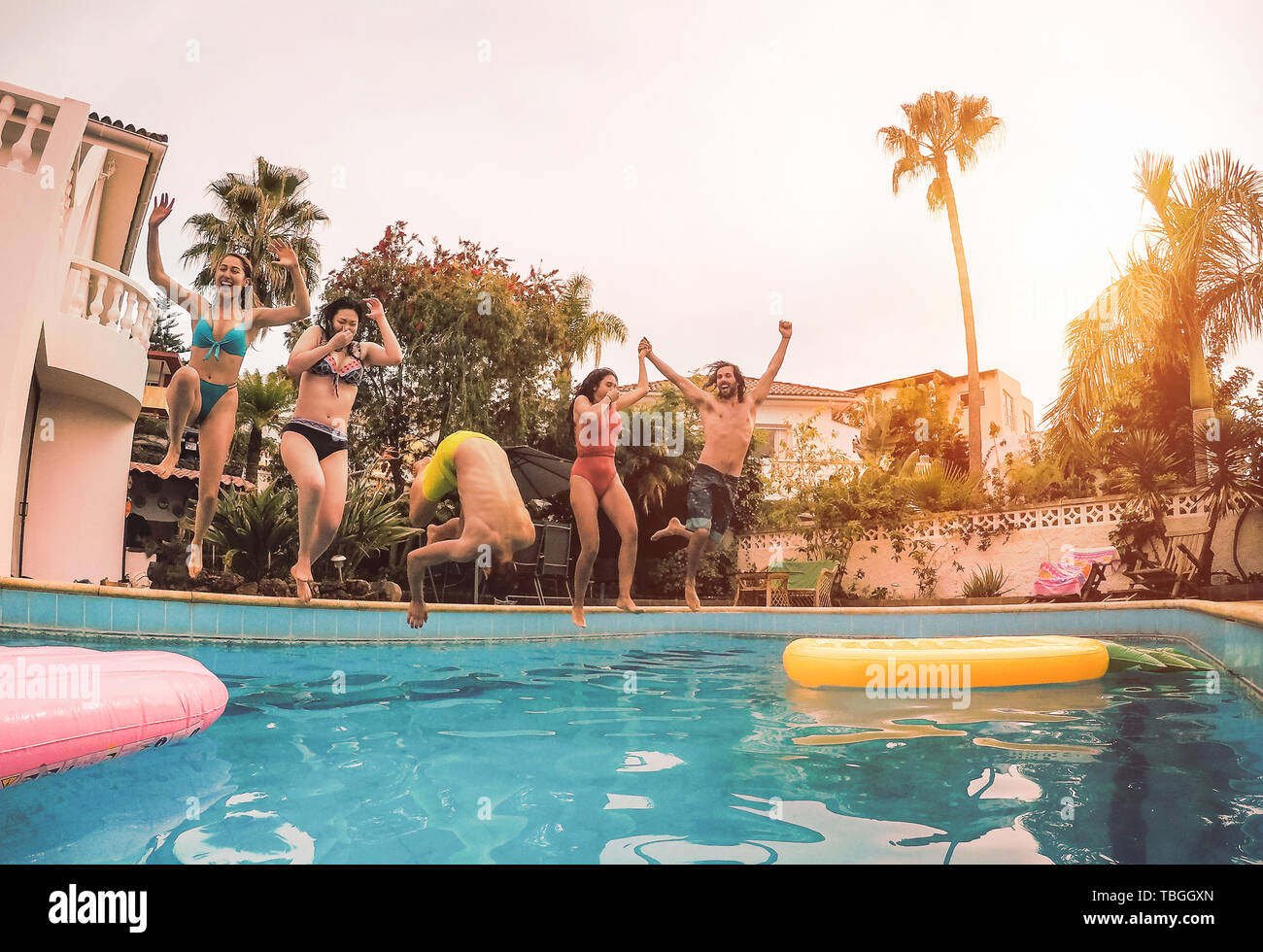 Happy friends sunset jump friendship hi-res stock photography and ...
