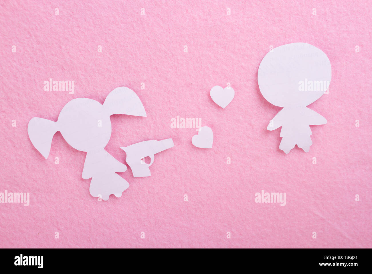 girl with gun and hearts. love concept Stock Photo - Alamy