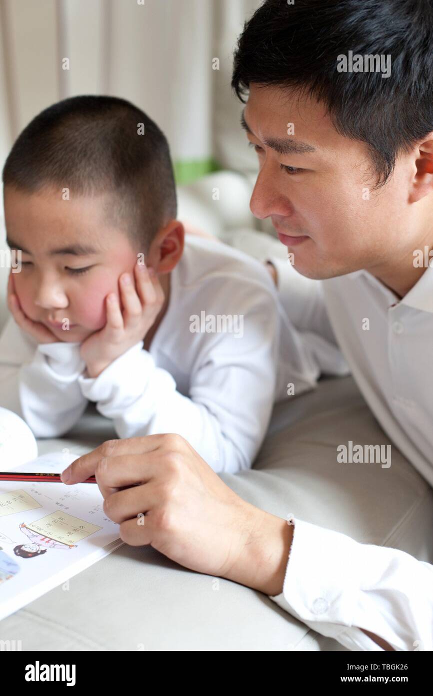 Elder reading to children hi-res stock photography and images - Alamy