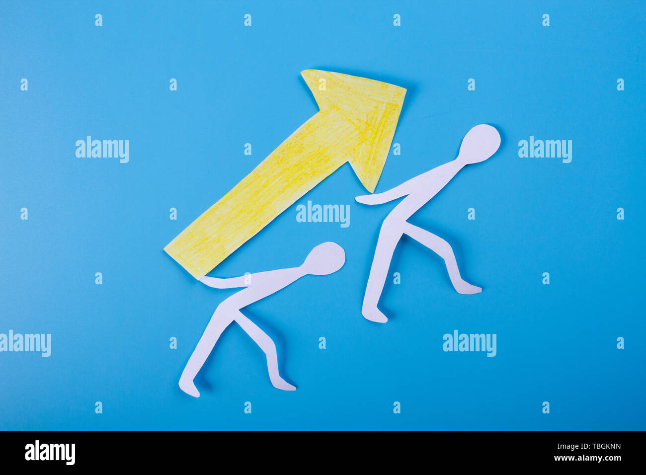 people holding arrow making it to go up Stock Photo - Alamy