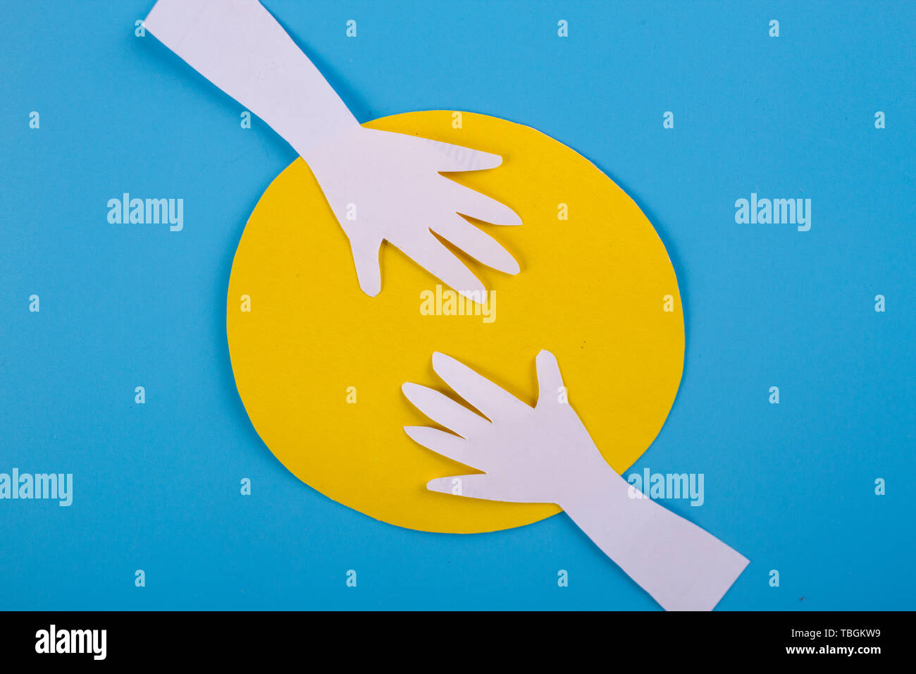 two hands reaching for each other. help concept Stock Photo - Alamy
