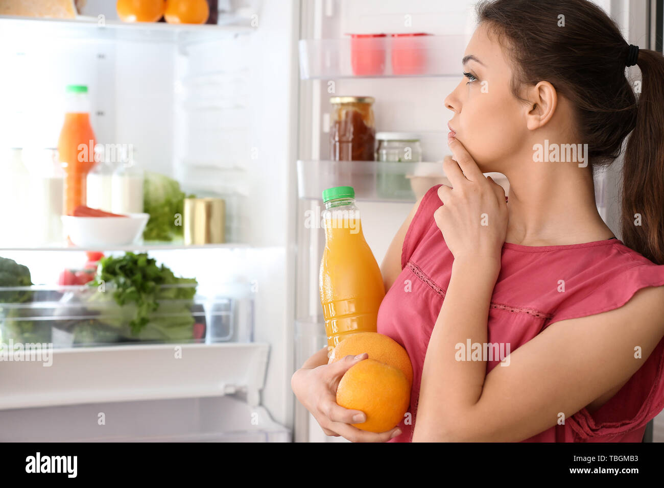 Taking food out fridge hi-res stock photography and images - Alamy