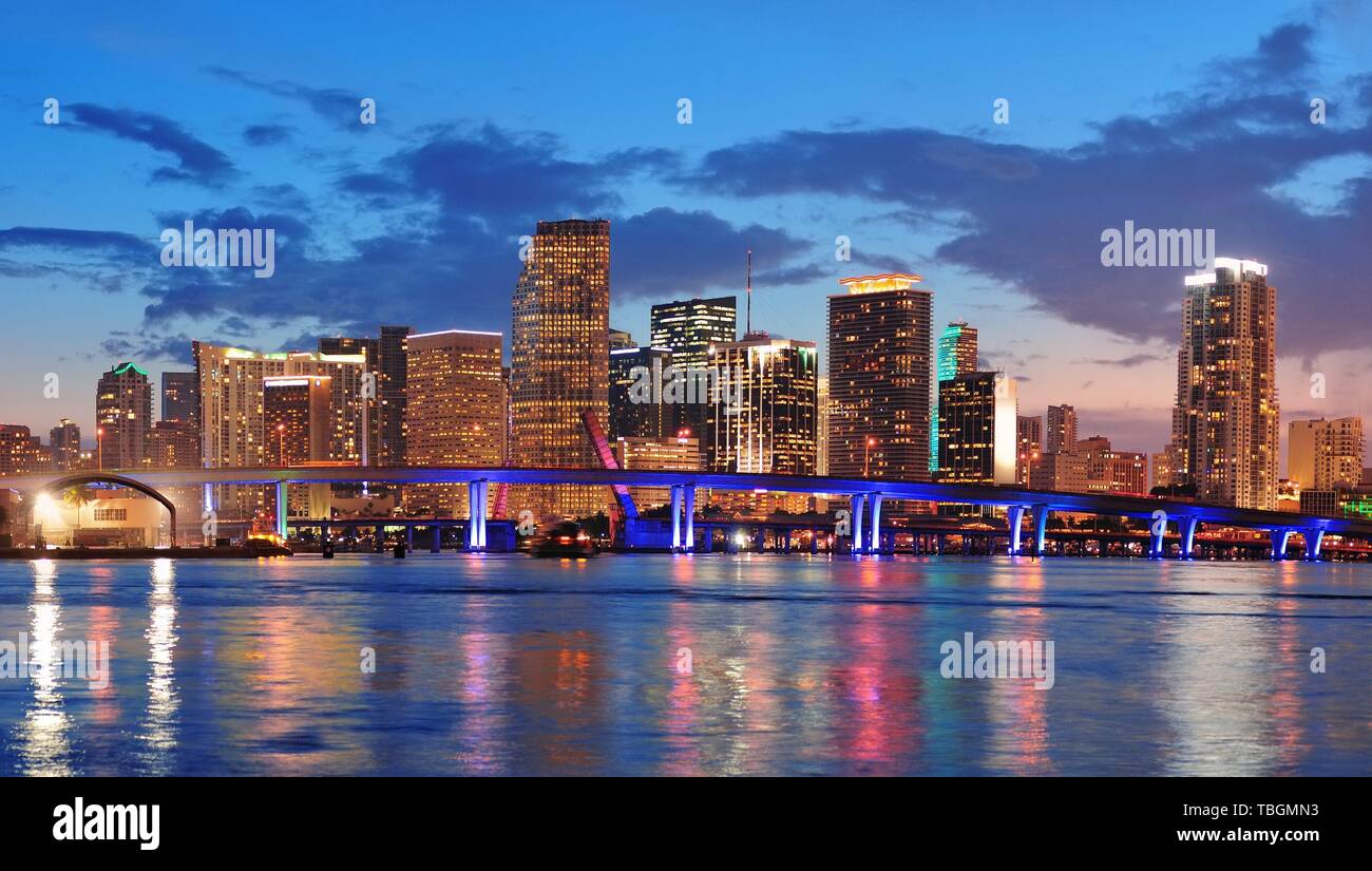 Miami city skyline panorama at dusk with urban skyscrapers and bridge ...