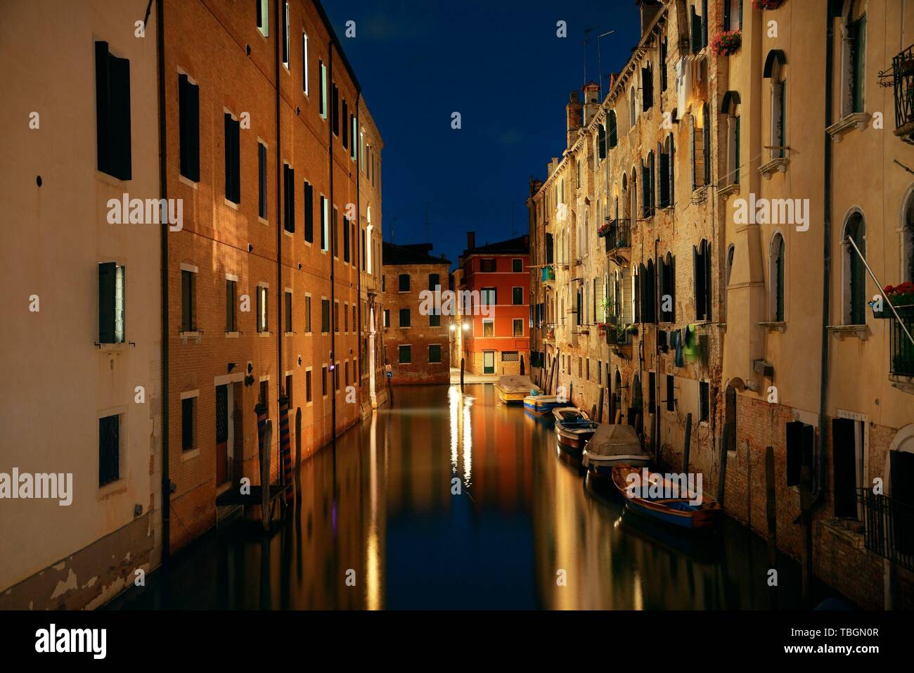 Venice canal view at night with historical buildings. Italy Stock Photo ...