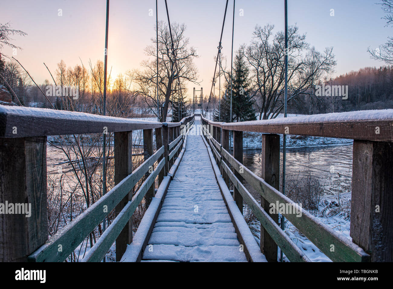 metal bridge over the river in country in winter frost Stock Photo - Alamy