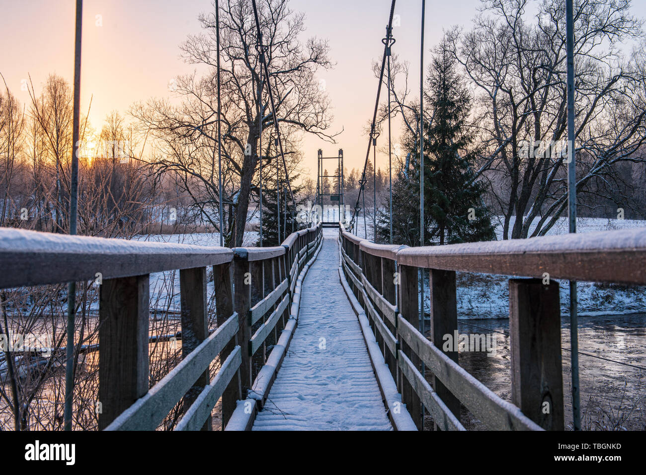metal bridge over the river in country in winter frost Stock Photo - Alamy