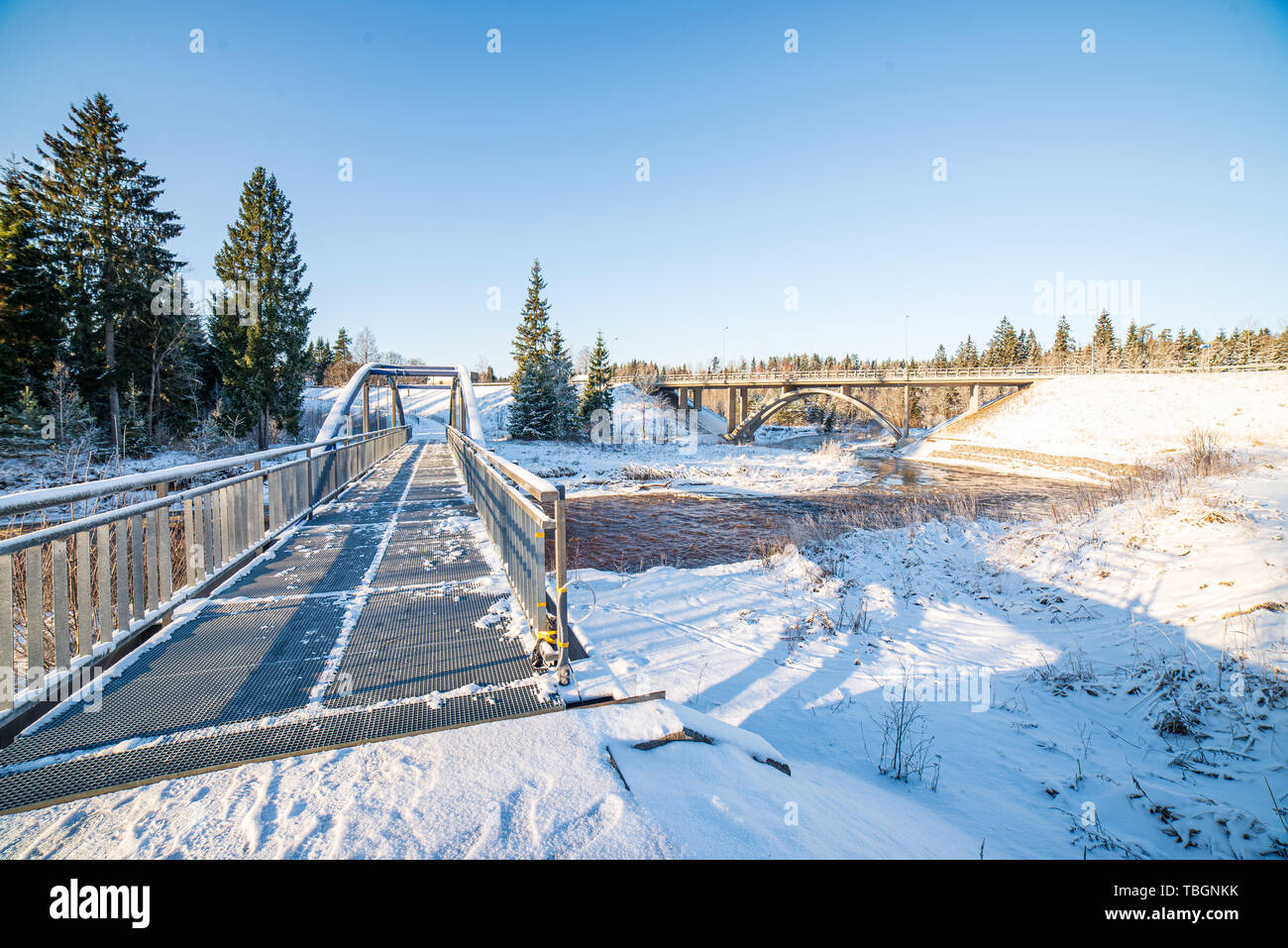 metal bridge over the river in country in winter frost Stock Photo - Alamy